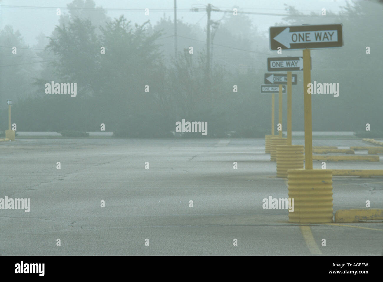 One way signs in fog Stock Photo - Alamy