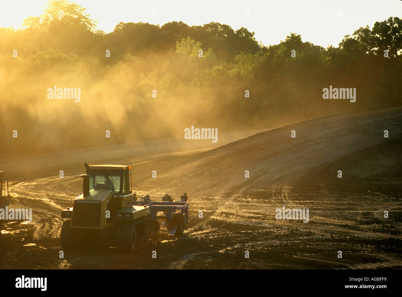 Caterpillar agricultural tractor with farm implement Stock Photo - Alamy