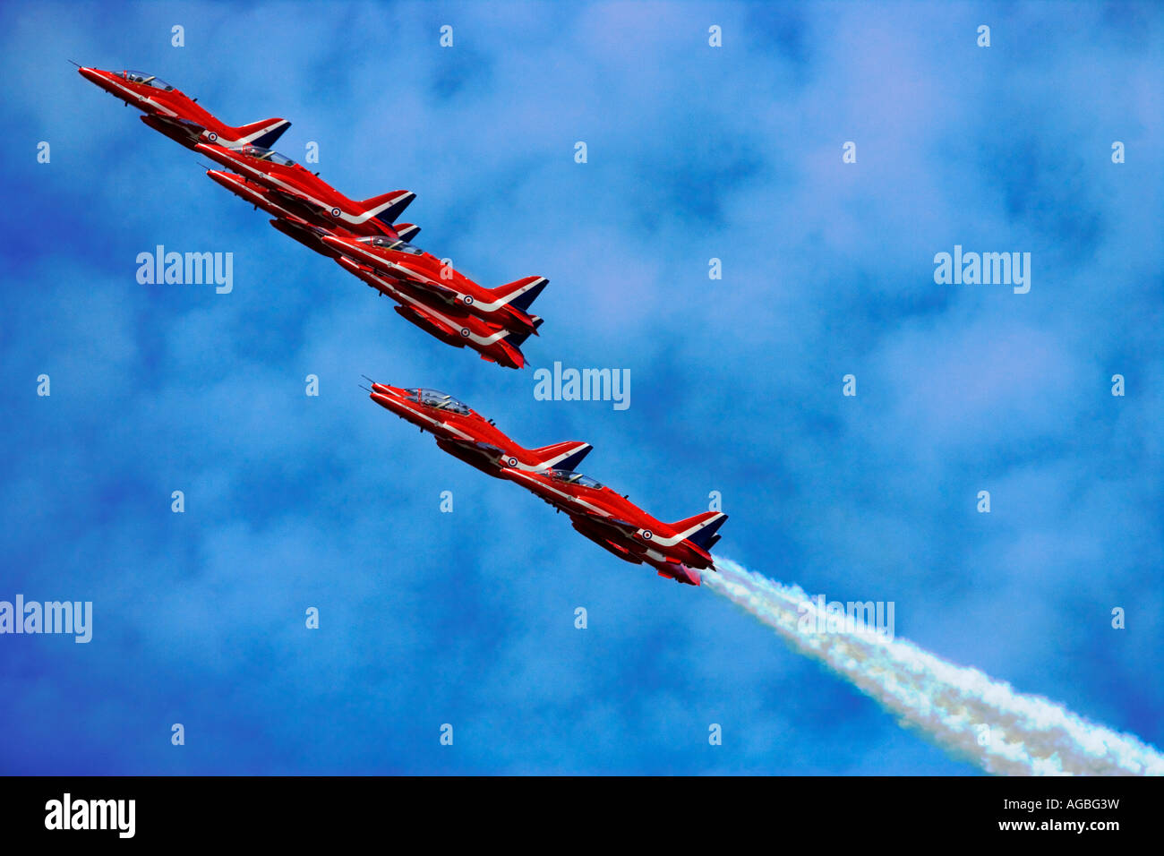 RAF Red Arrows aerobatic team displaying in blue sky Stock Photo - Alamy