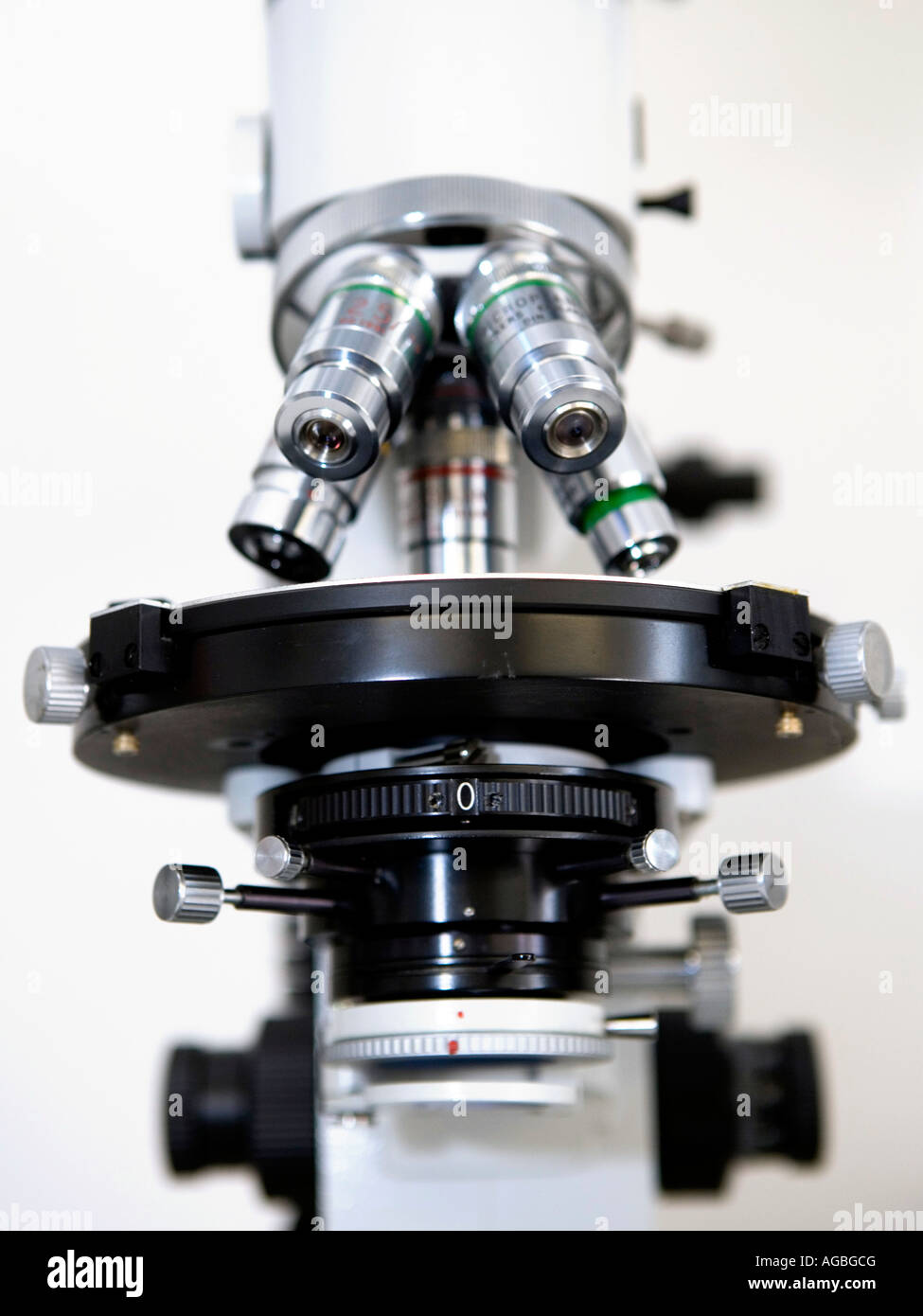 Microbiologist scientist looking through microscope and concentrating ...