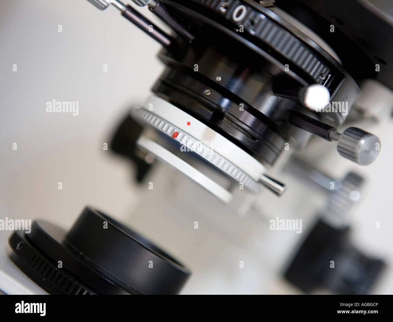 Microbiologist scientist looking through microscope and concentrating ...