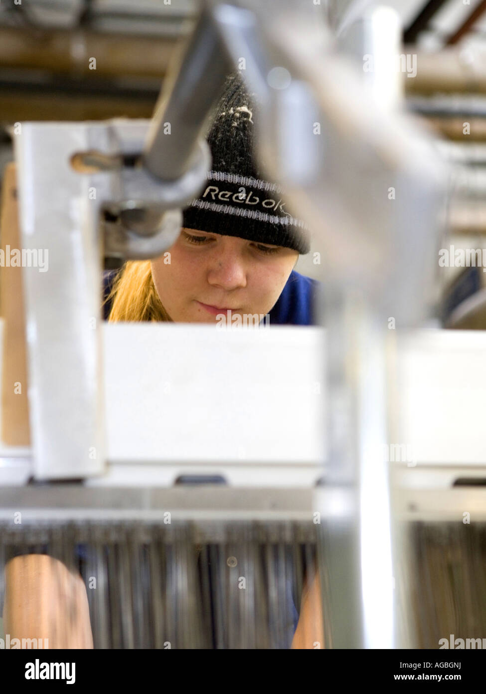 Young male worker at textile factory Stock Photo - Alamy