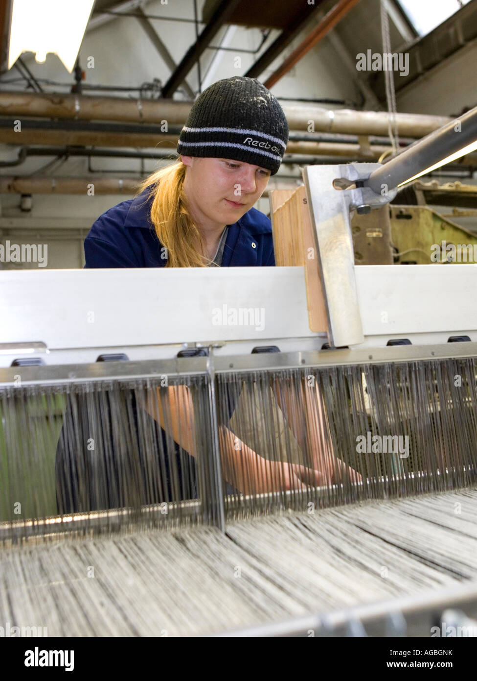 Young male worker at textile factory Stock Photo - Alamy