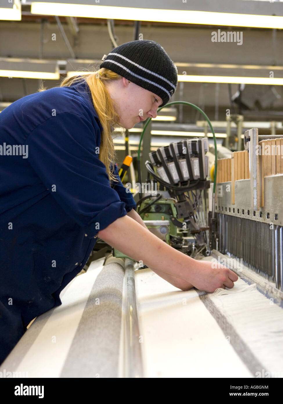 Young male worker at textile factory Stock Photo - Alamy