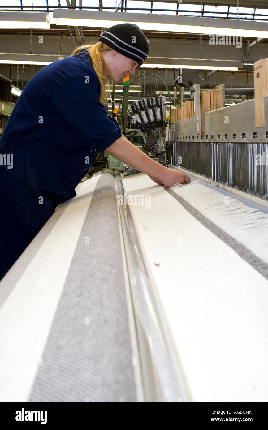 Young male worker at textile factory Stock Photo - Alamy