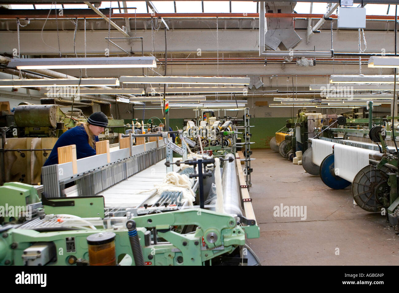 Young male worker at textile factory Stock Photo - Alamy