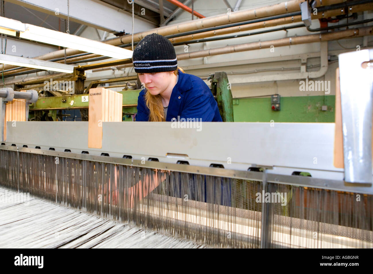 Young male worker at textile factory Stock Photo - Alamy