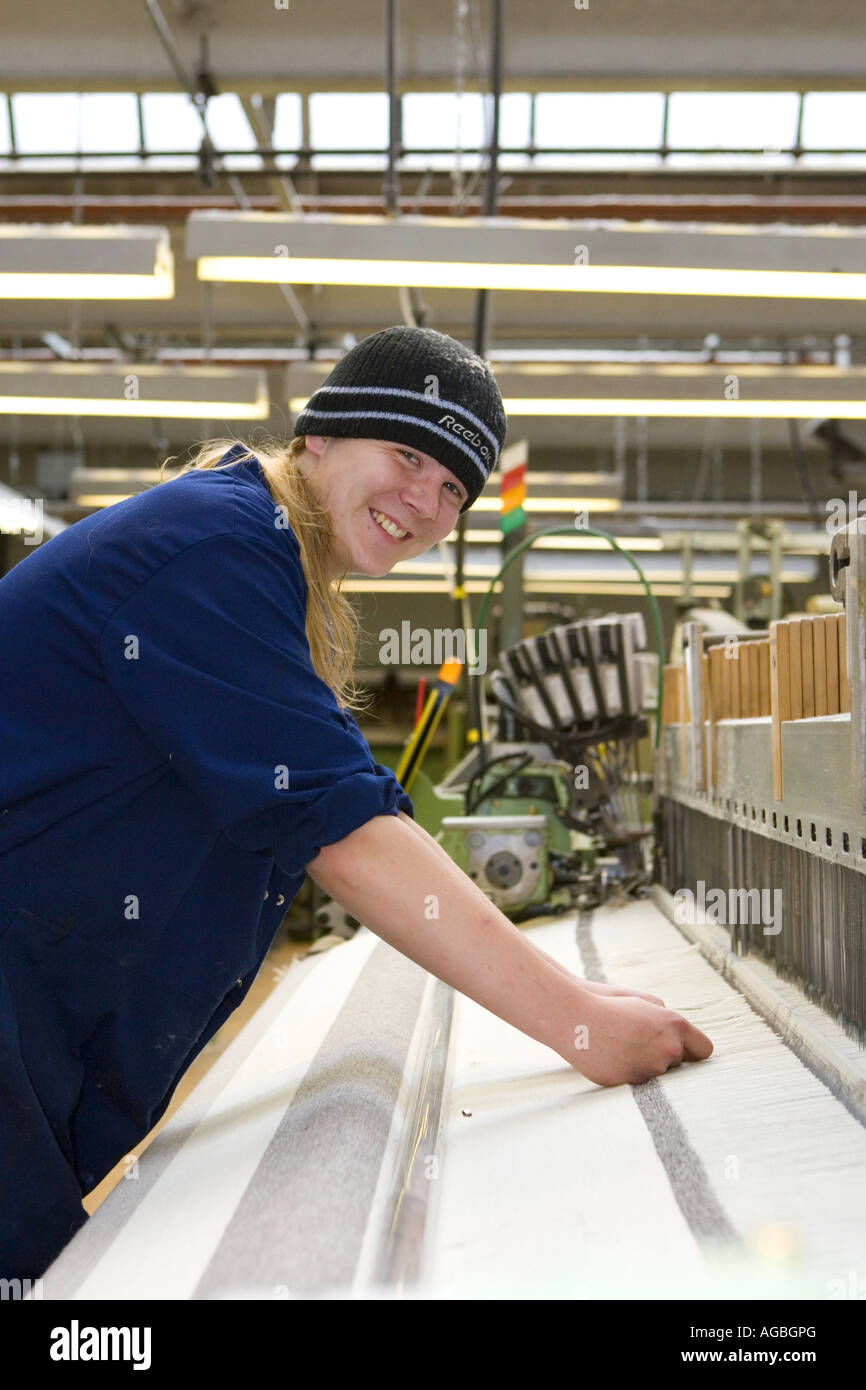 Young male worker at textile factory Stock Photo - Alamy