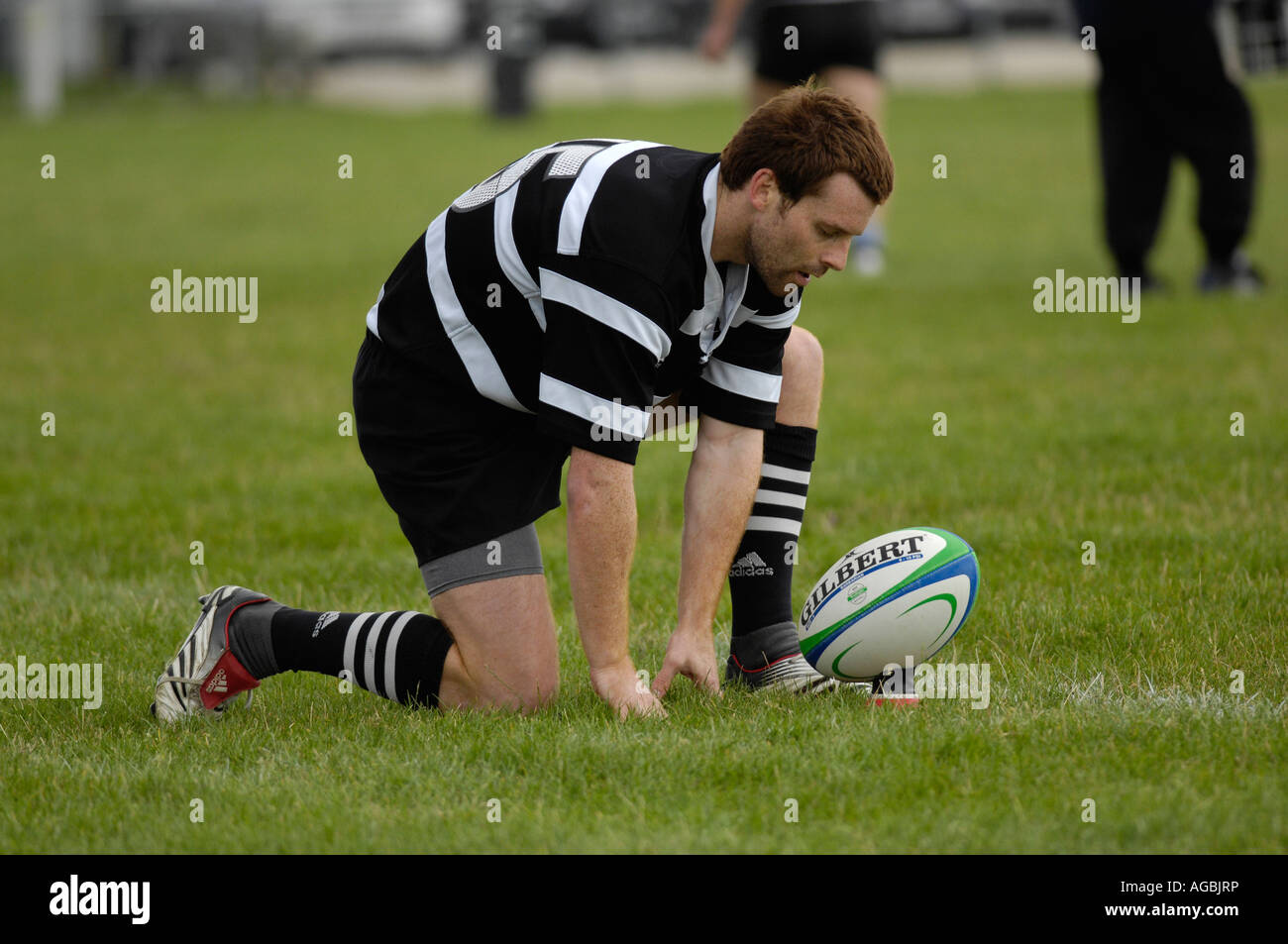 rugby player places ball before conversion attempt Stock Photo - Alamy