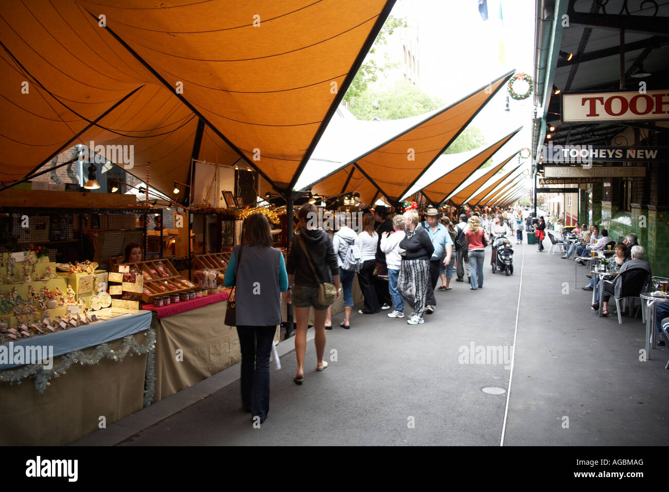 Outdoor covered market with stalls and people in the Rocks area of ...