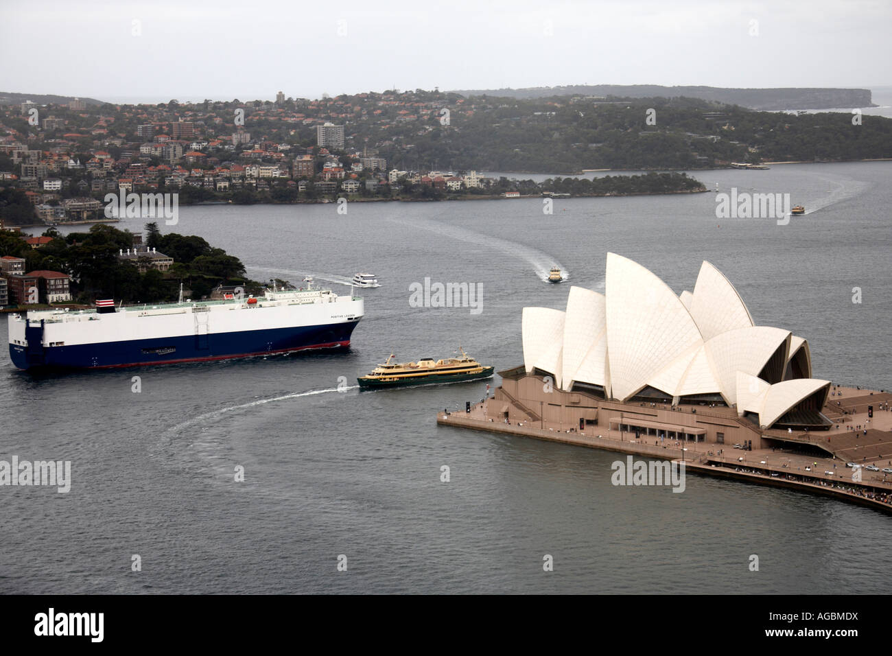 High level oblique aerial view of merchant ship and Opera House in ...