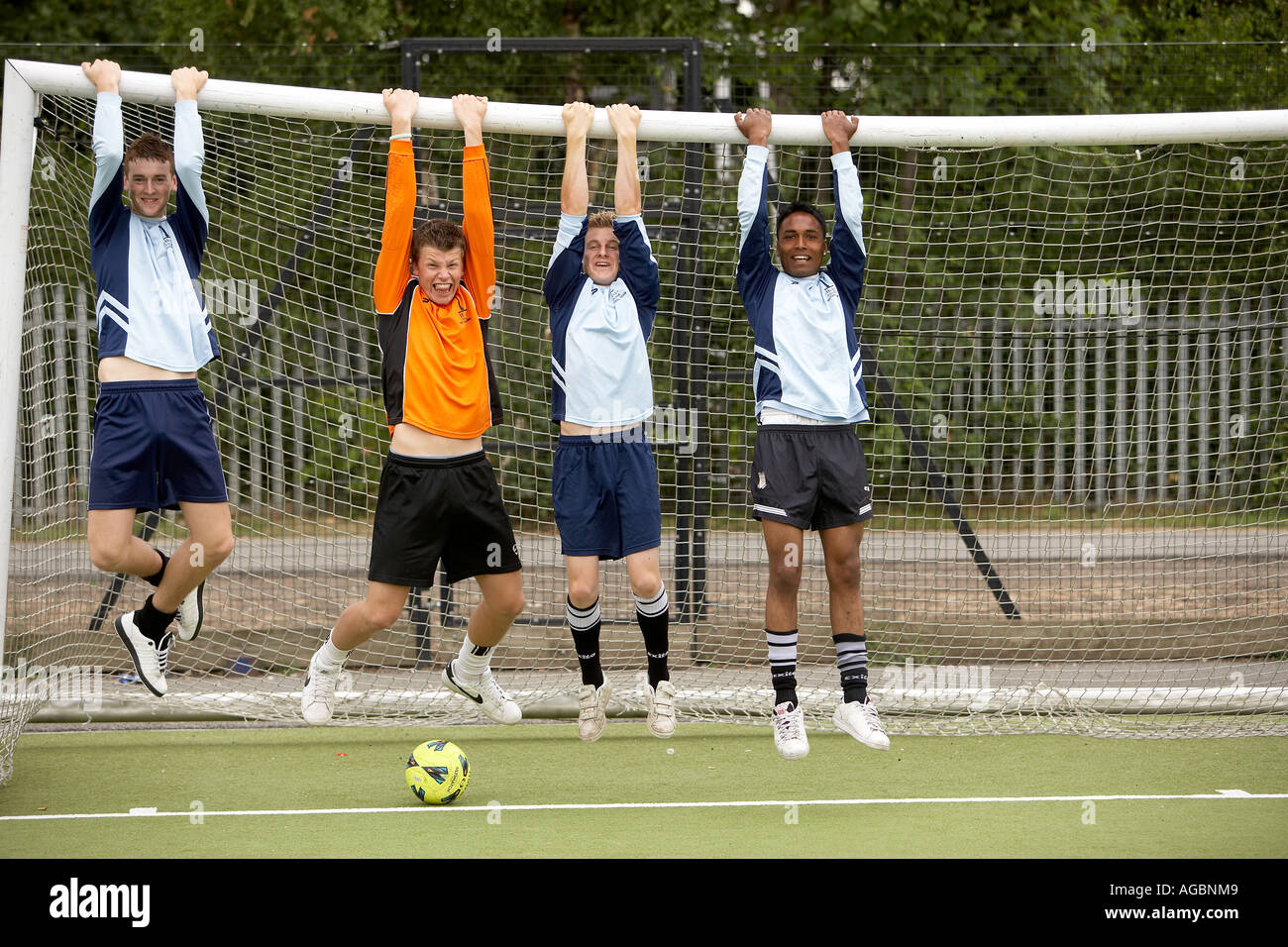 Action jump football arms hi-res stock photography and images - Alamy