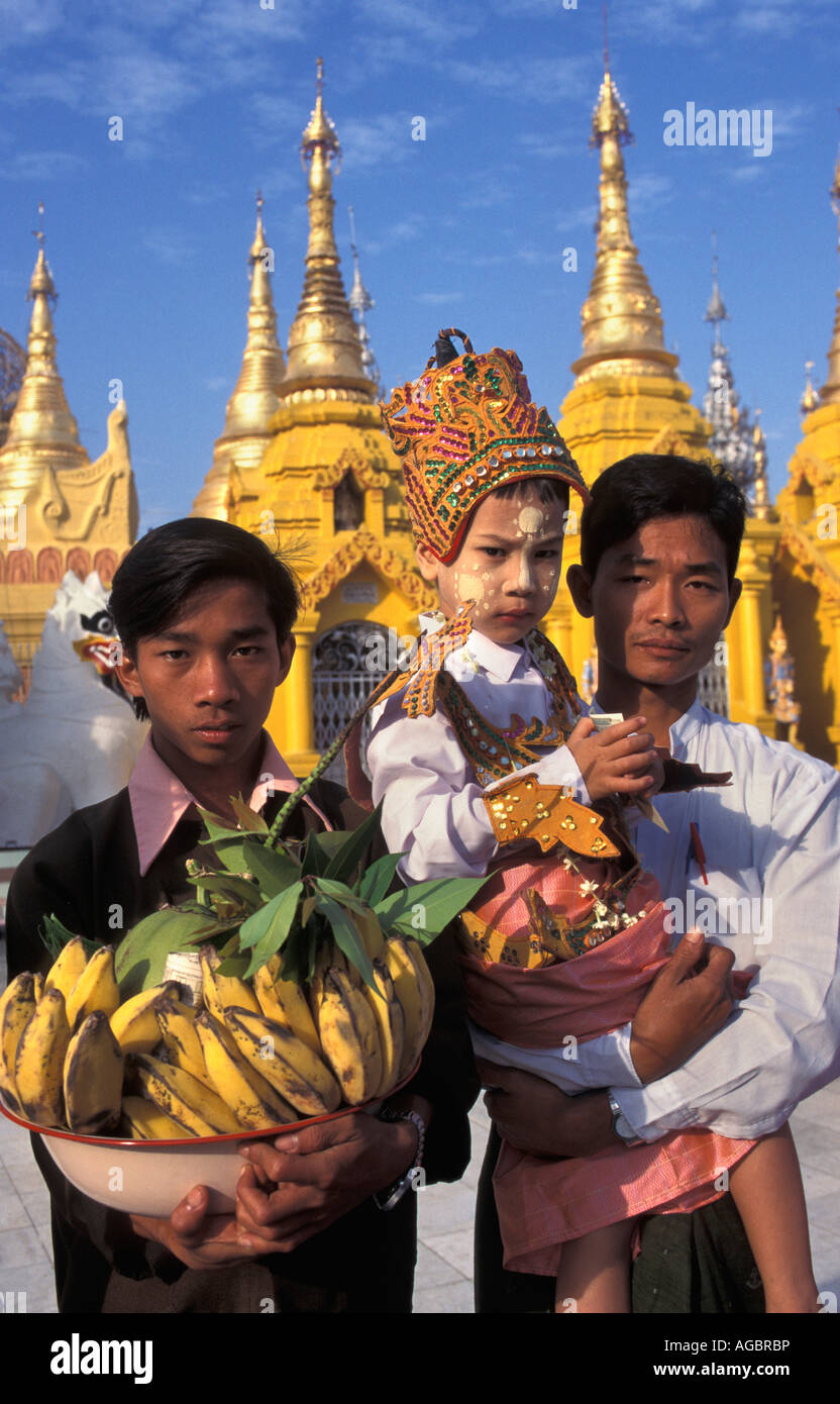 Myanmar, Yangon, Father with sons as novice during shin puy ceremony ...