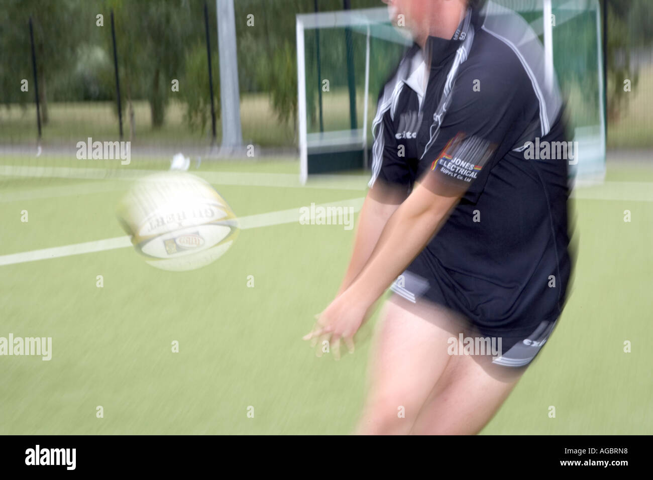 Rugby player passing the ball Blurred Stock Photo - Alamy