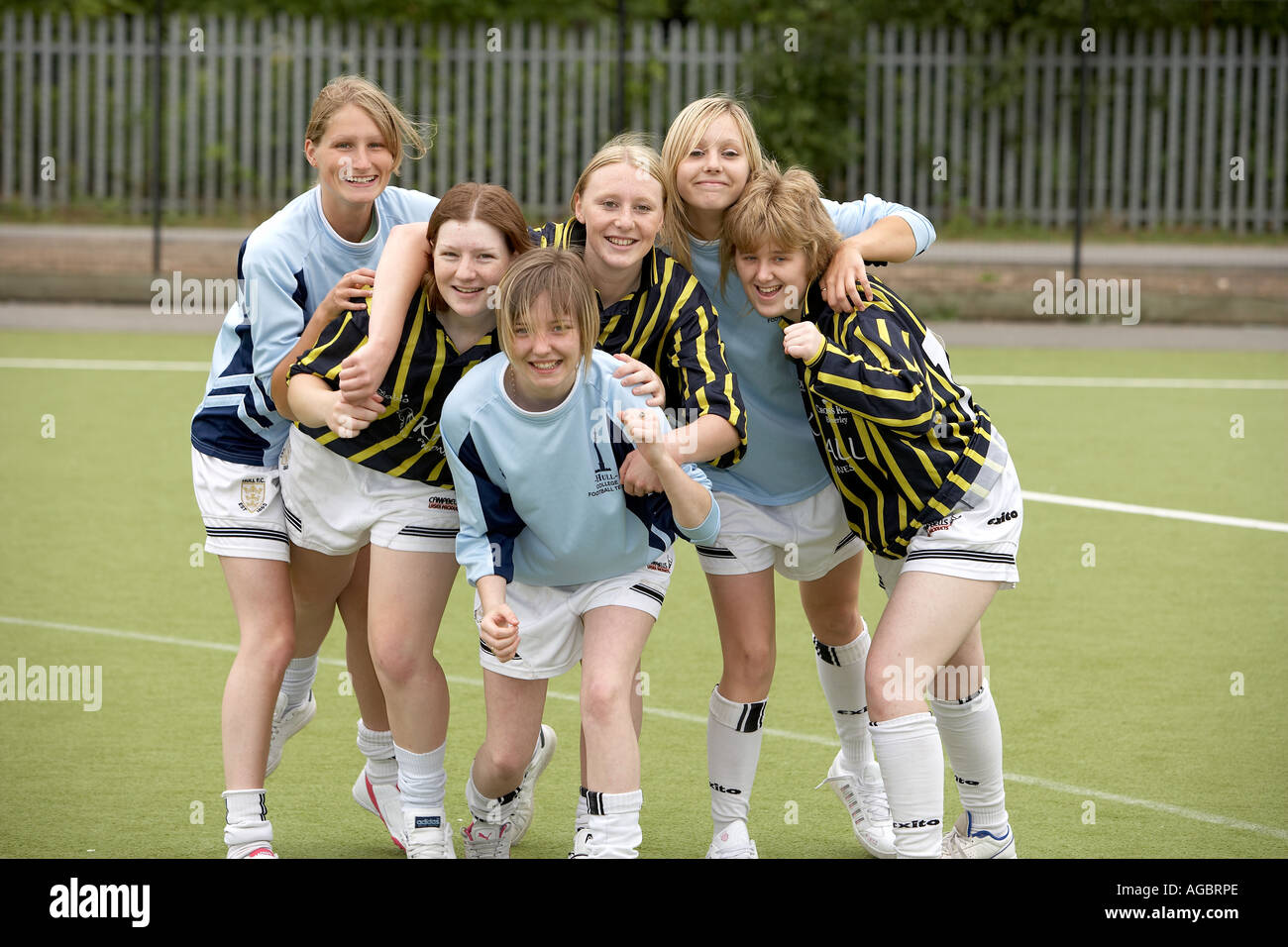 Six girl football players celebrate victory after match Stock Photo - Alamy