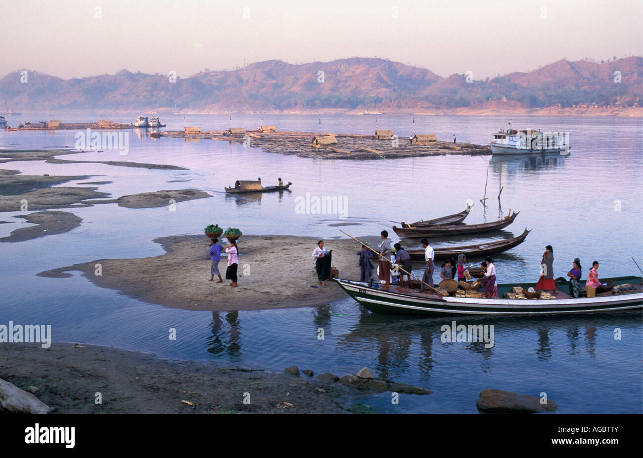 Myanmar, Pye, People standing by Ayeyarwady river Stock Photo - Alamy