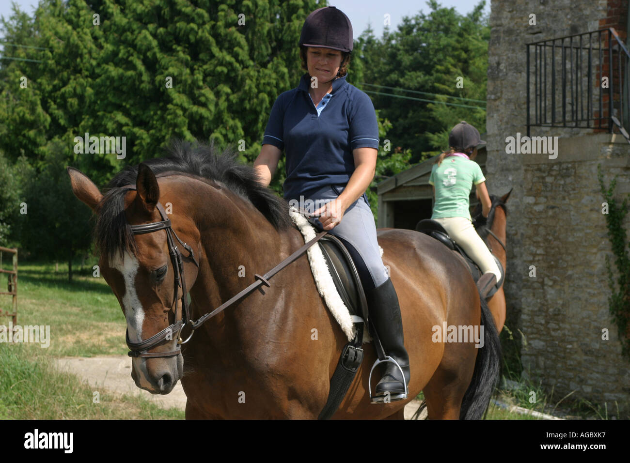 Two female horse riders Stock Photo - Alamy