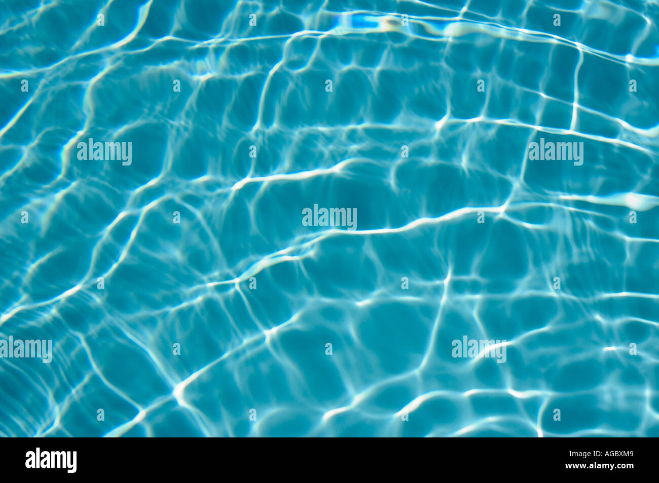 Sunlight ripple patterns on the bottom of swimming pool California USA ...