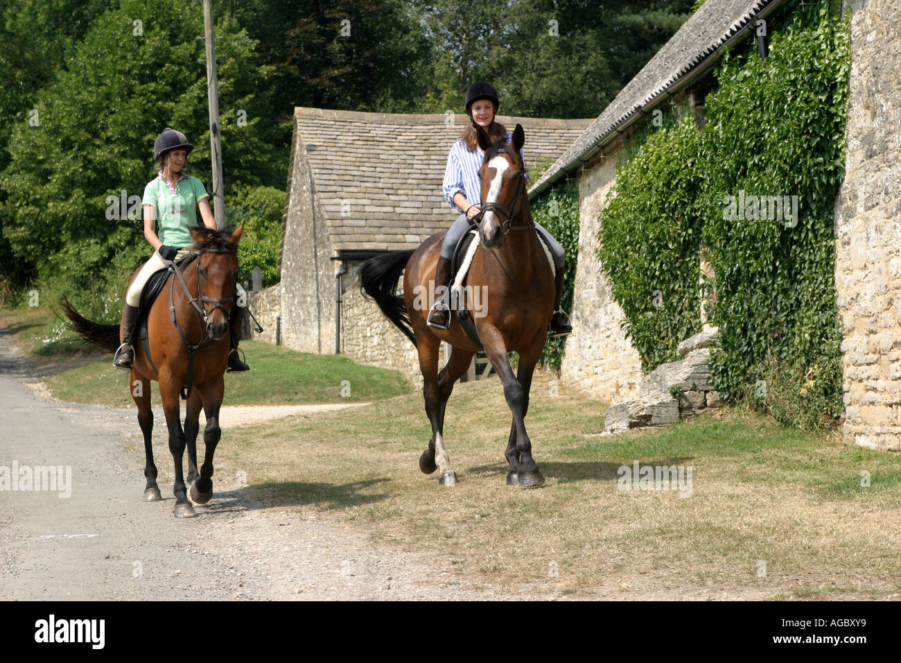 Two sisters horse riding in the UK Stock Photo - Alamy