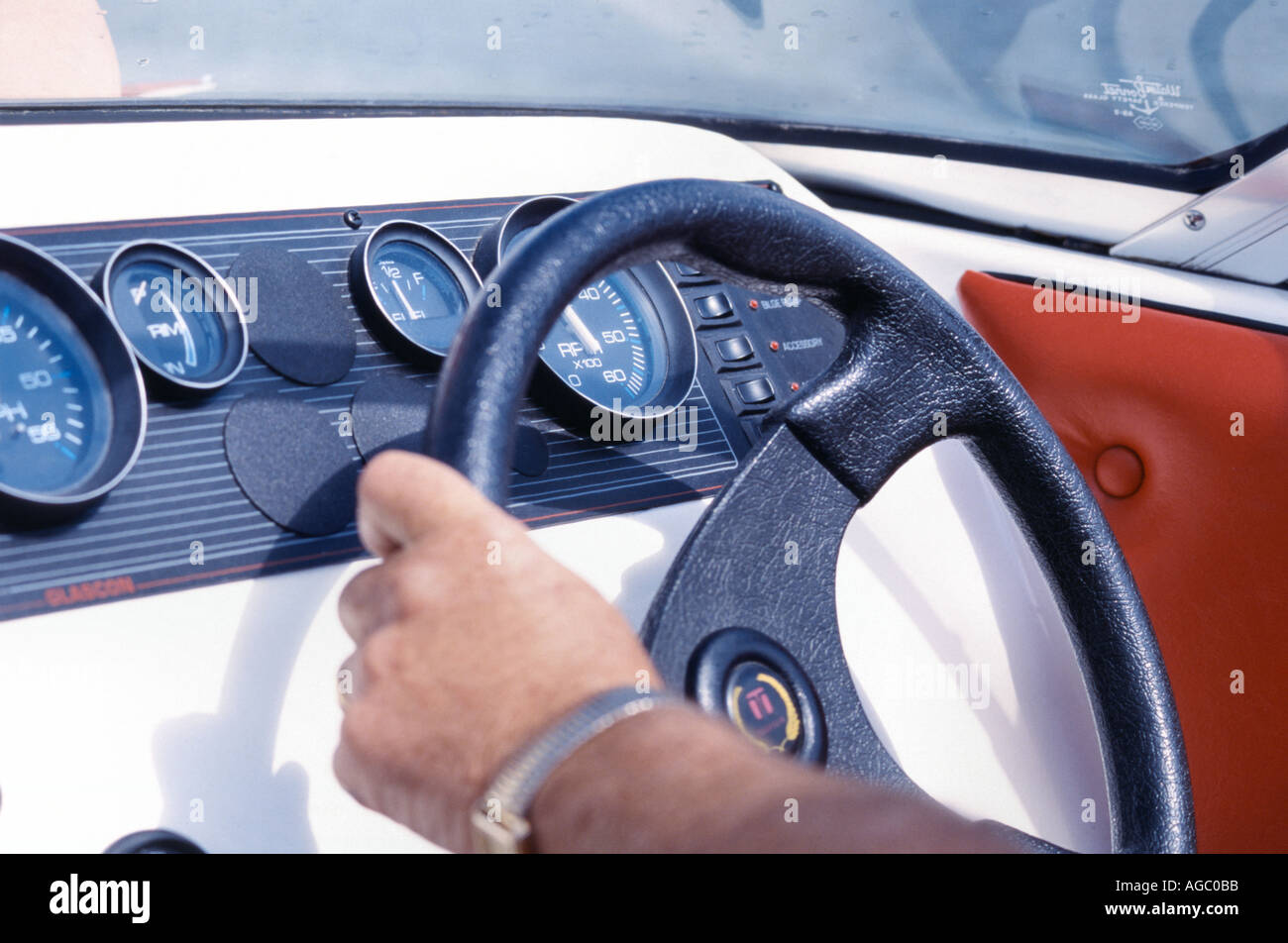 Steering a boat Stock Photo - Alamy