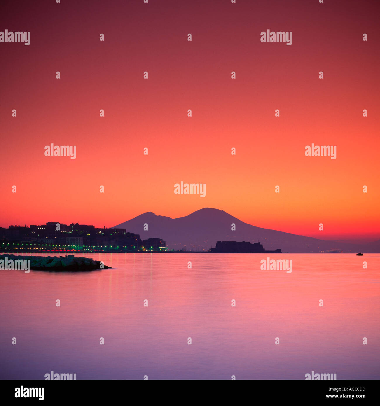 The brooding active volcano of Vesuvius at sunrise viewed from across ...