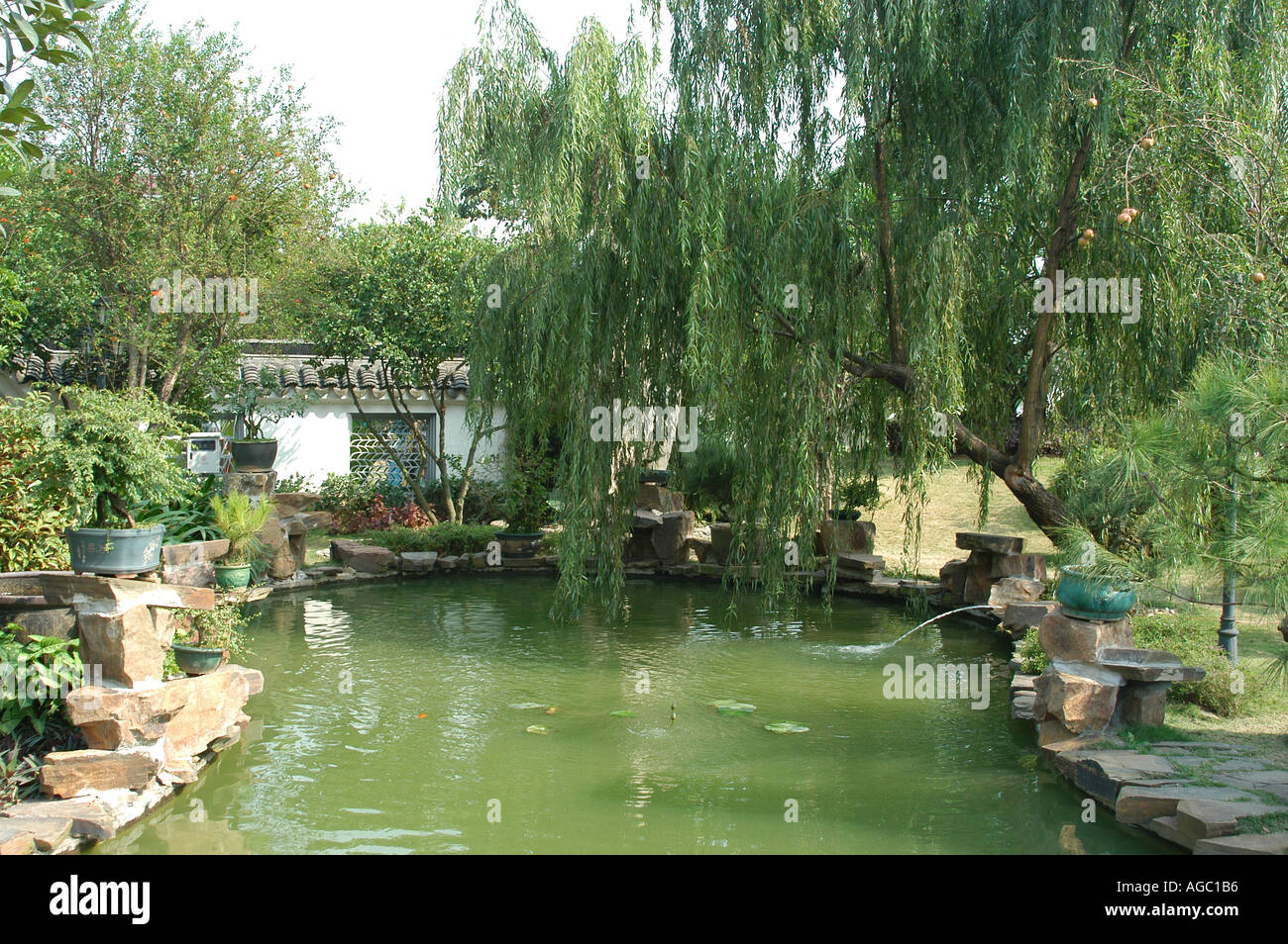 landscape house pond and trees in zhongshan south china Stock Photo - Alamy