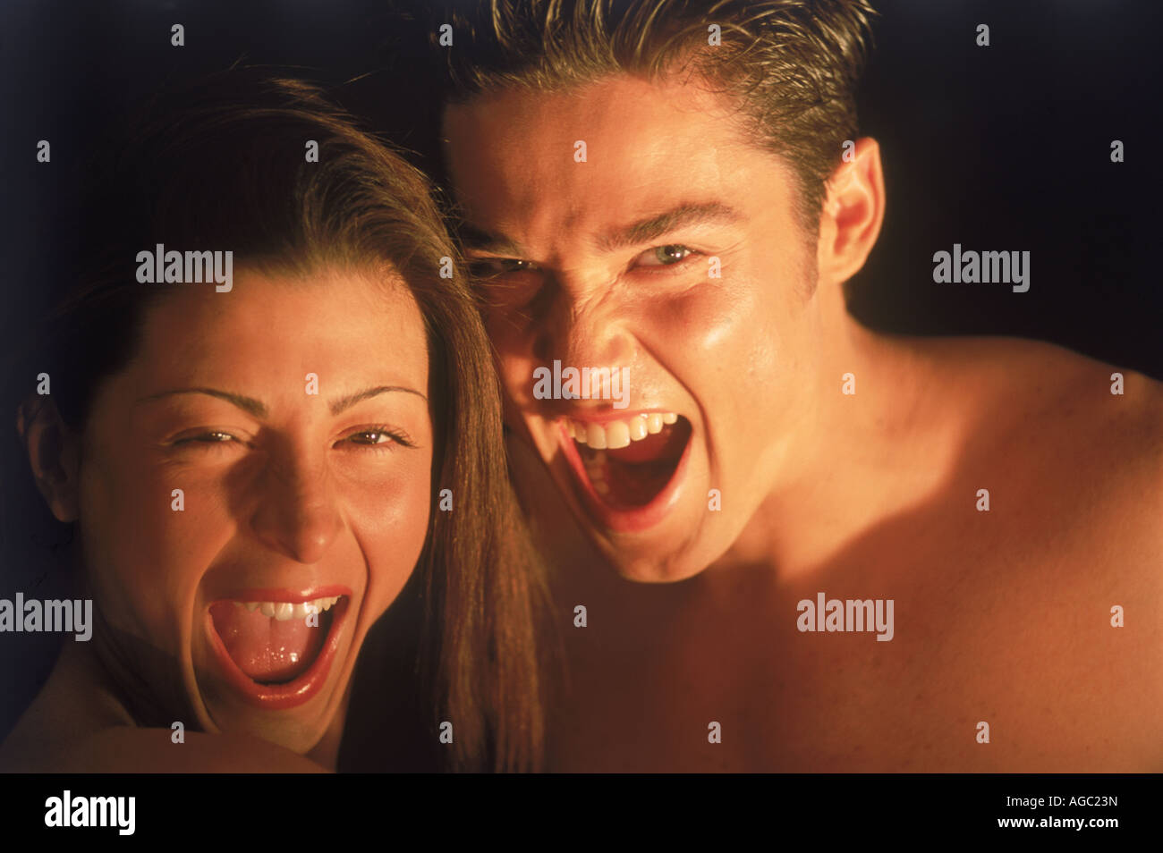 Couple with wild happy expressions Stock Photo - Alamy