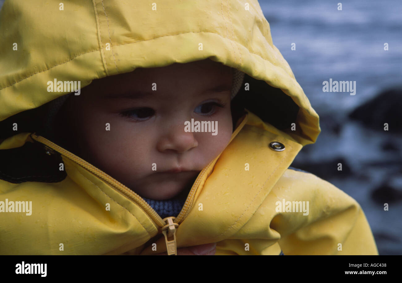 children wearing a raincoat Stock Photo - Alamy