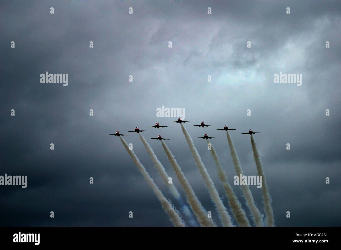 The Red Arrows flying through a Storm Stock Photo - Alamy