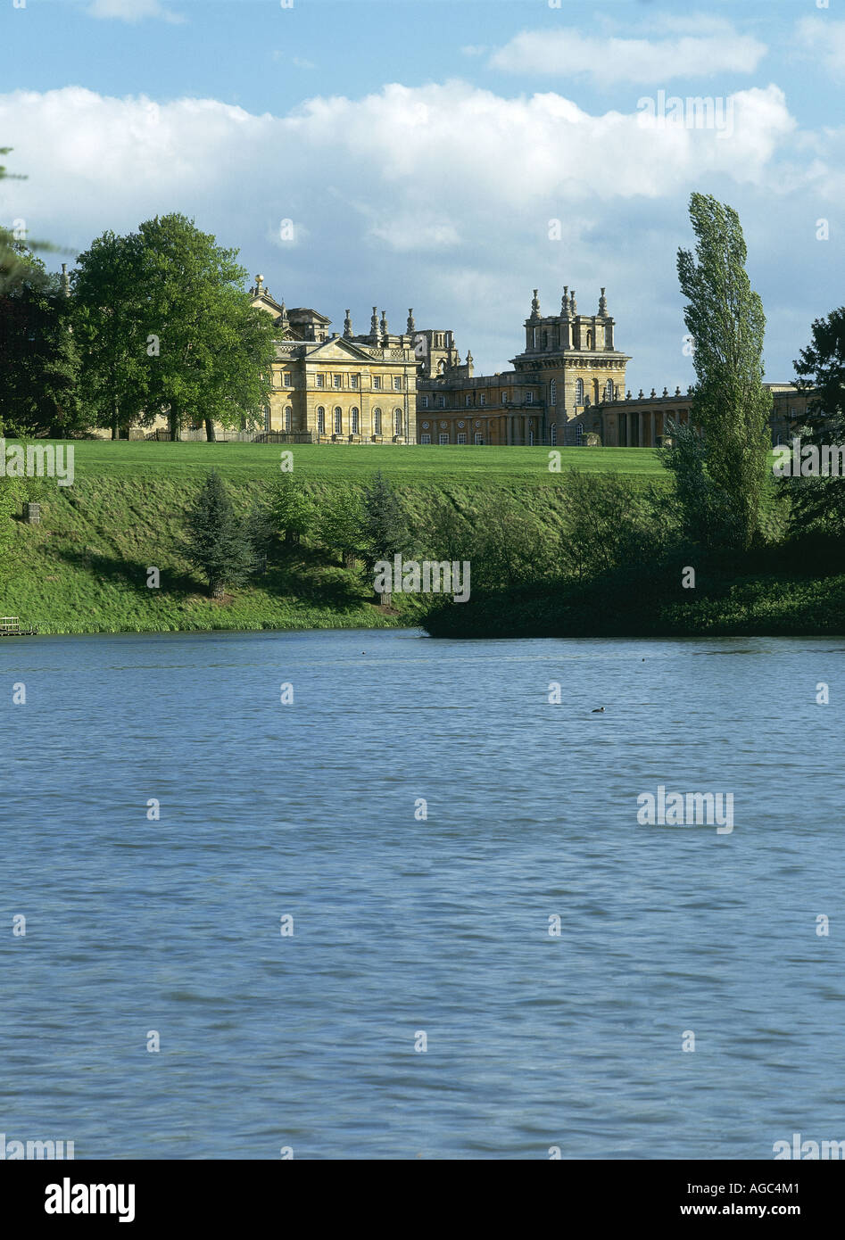 View across the lake to the stately home of Blenheim Palace Designed by ...