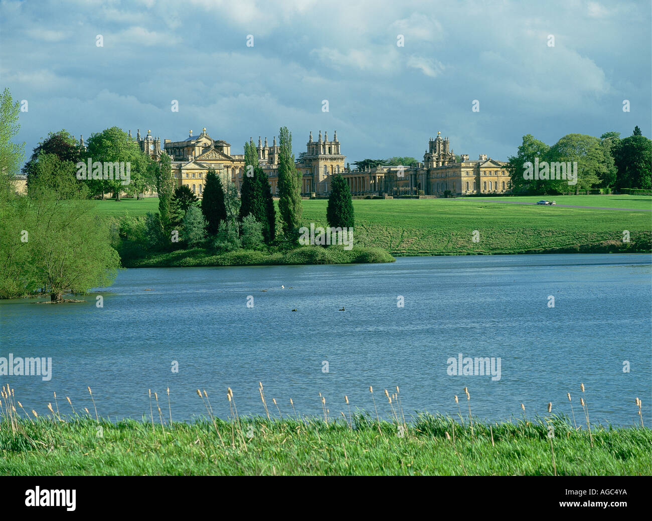 View across the lake to the stately home of Blenheim Palace Designed by ...