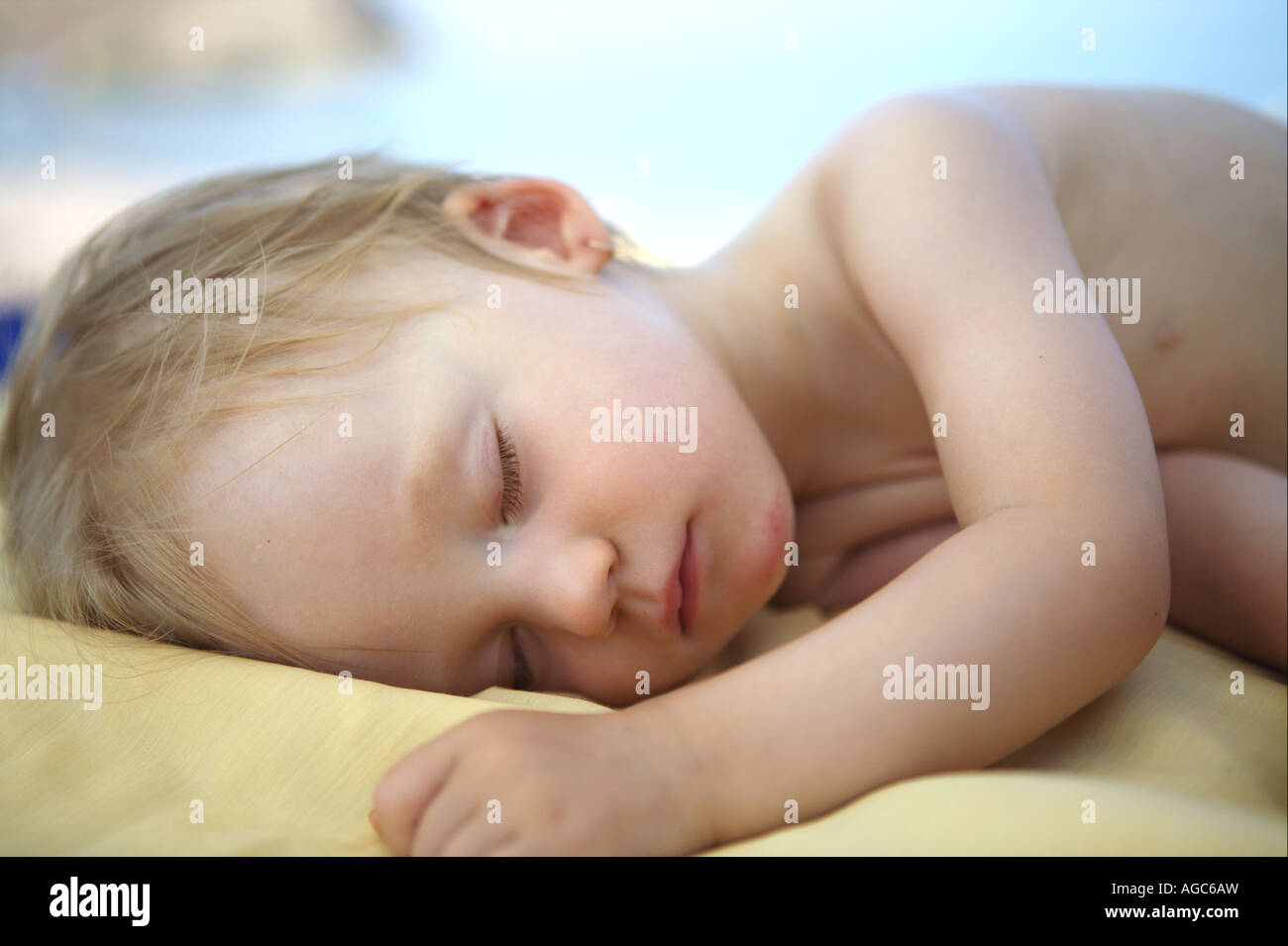 Baby sleeping on the beach Summer holiday Lesbos island Greece Stock ...