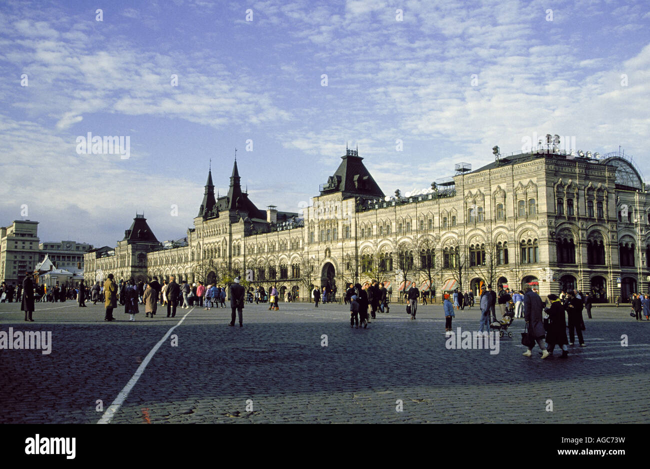 A view of people in Red Square in front of the massive GUM Department ...