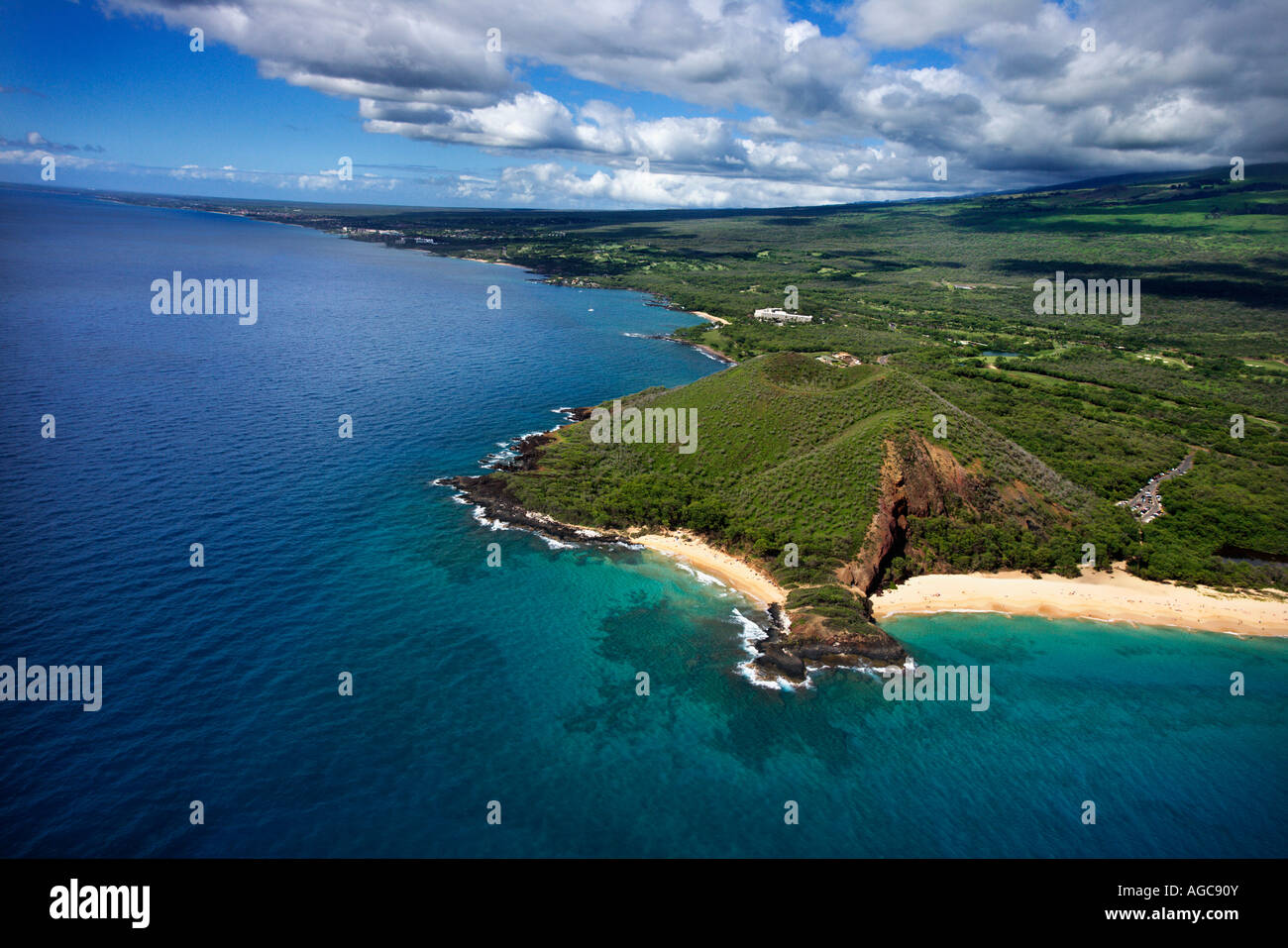 Aerial of Maui Hawaii coastline with crater and cliffs and beach on ...