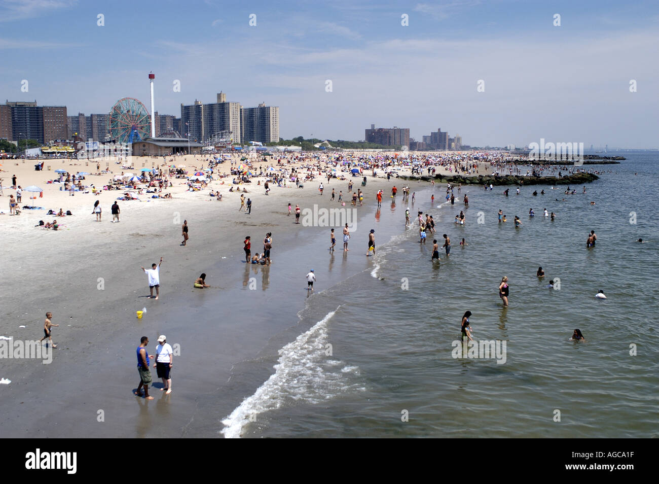 Coney Island crowded sandy beach shore water Stock Photo - Alamy