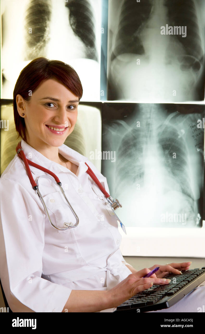 Medical nurse inputs patient data into computer Stock Photo - Alamy