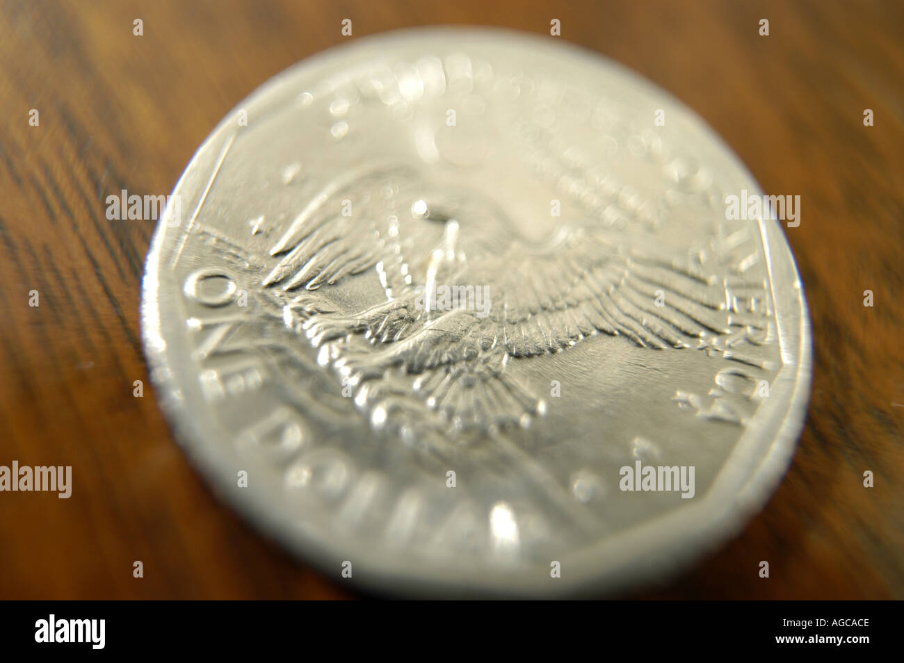 Silver coin on wood horizontal Stock Photo - Alamy