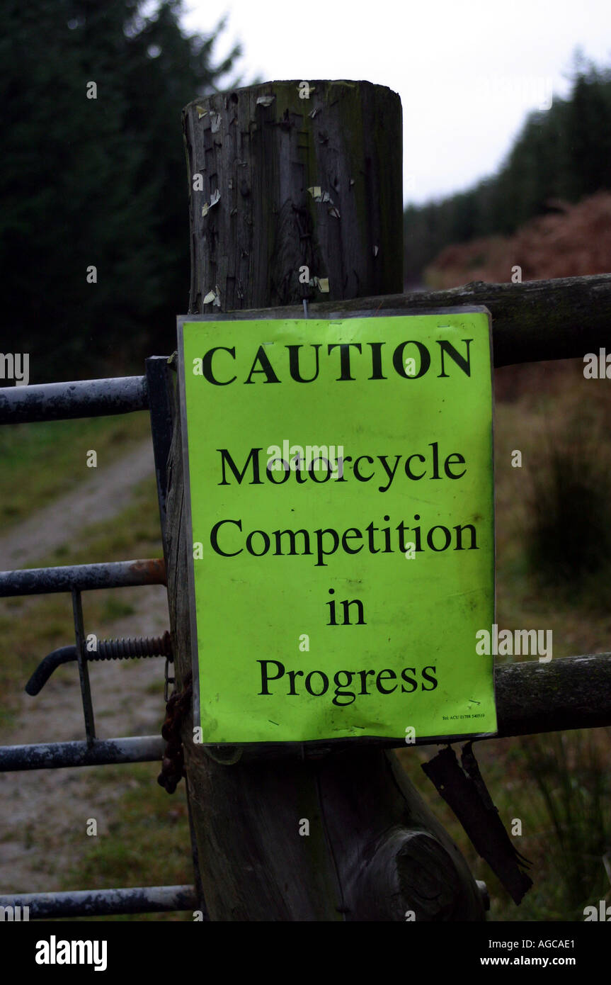 Caution Motorcycle competition in Progress sign Stock Photo - Alamy