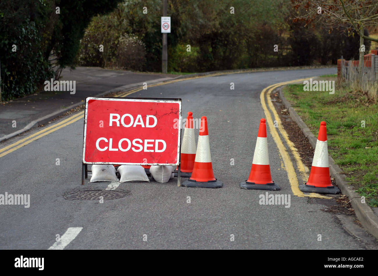 Road Closed sign with bollards blocking access Stock Photo - Alamy