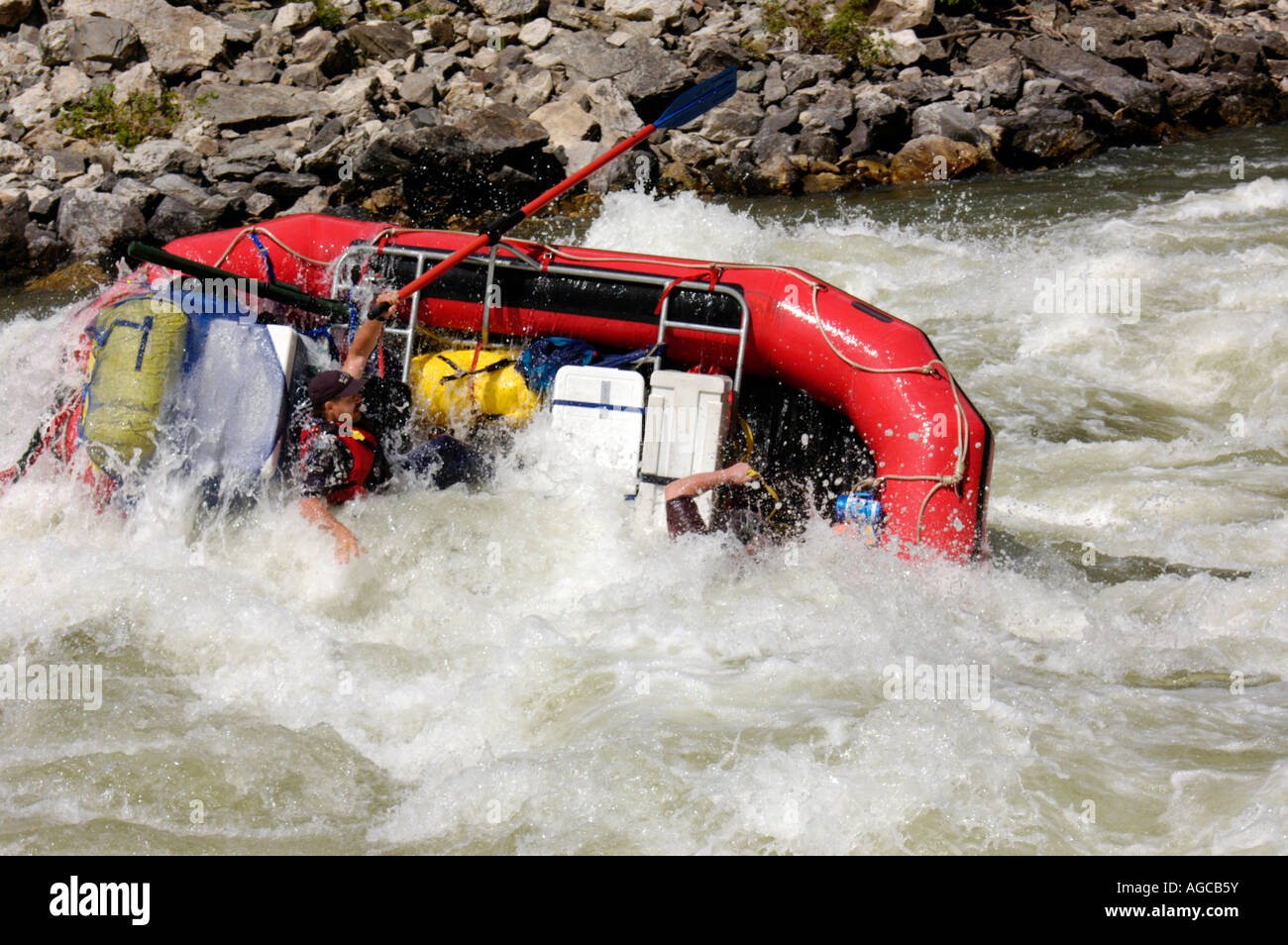 Rafters hit a huge wave and flip their boat while rafting Cramer Creek ...