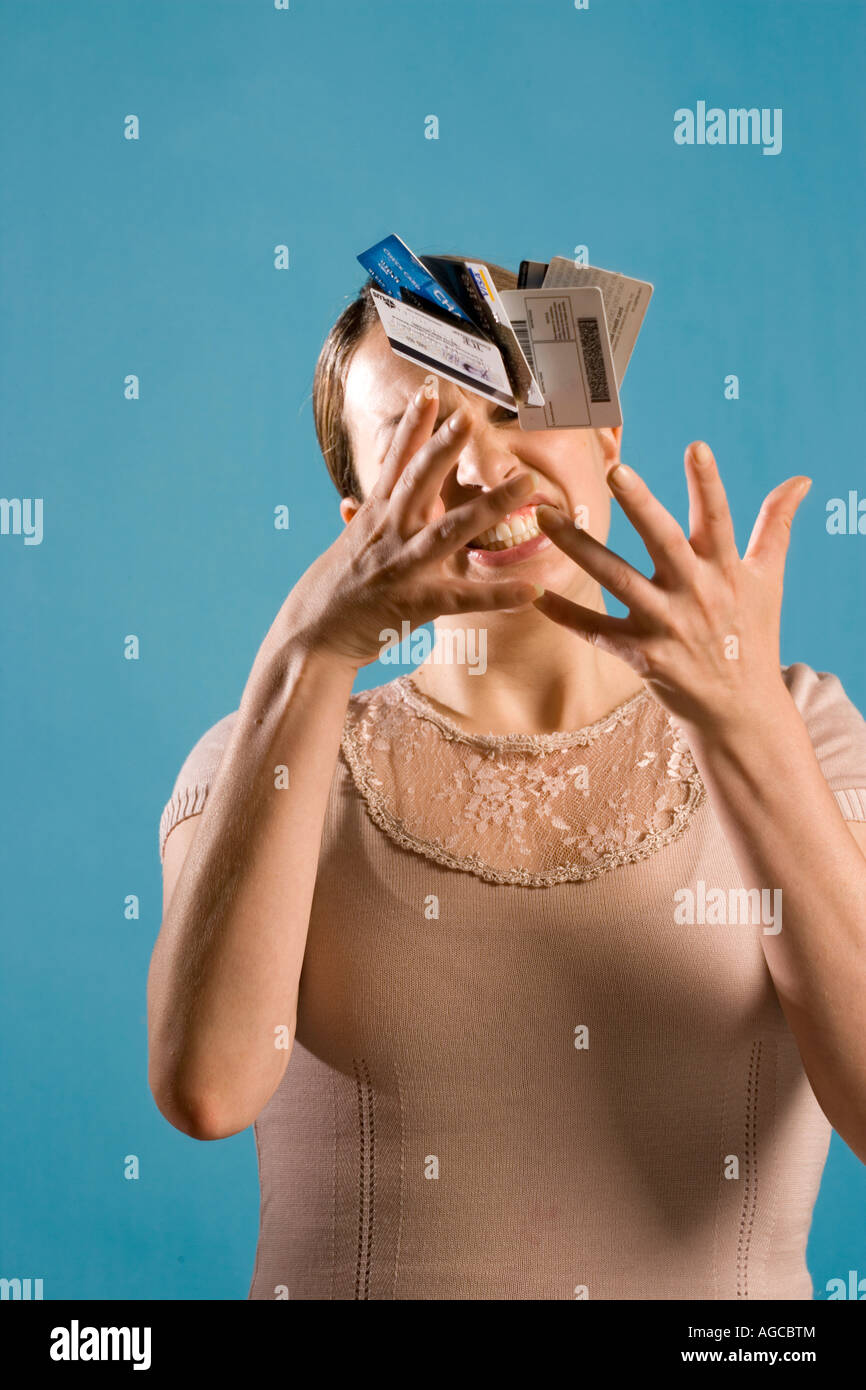 Woman throwing her credit cards Stock Photo - Alamy