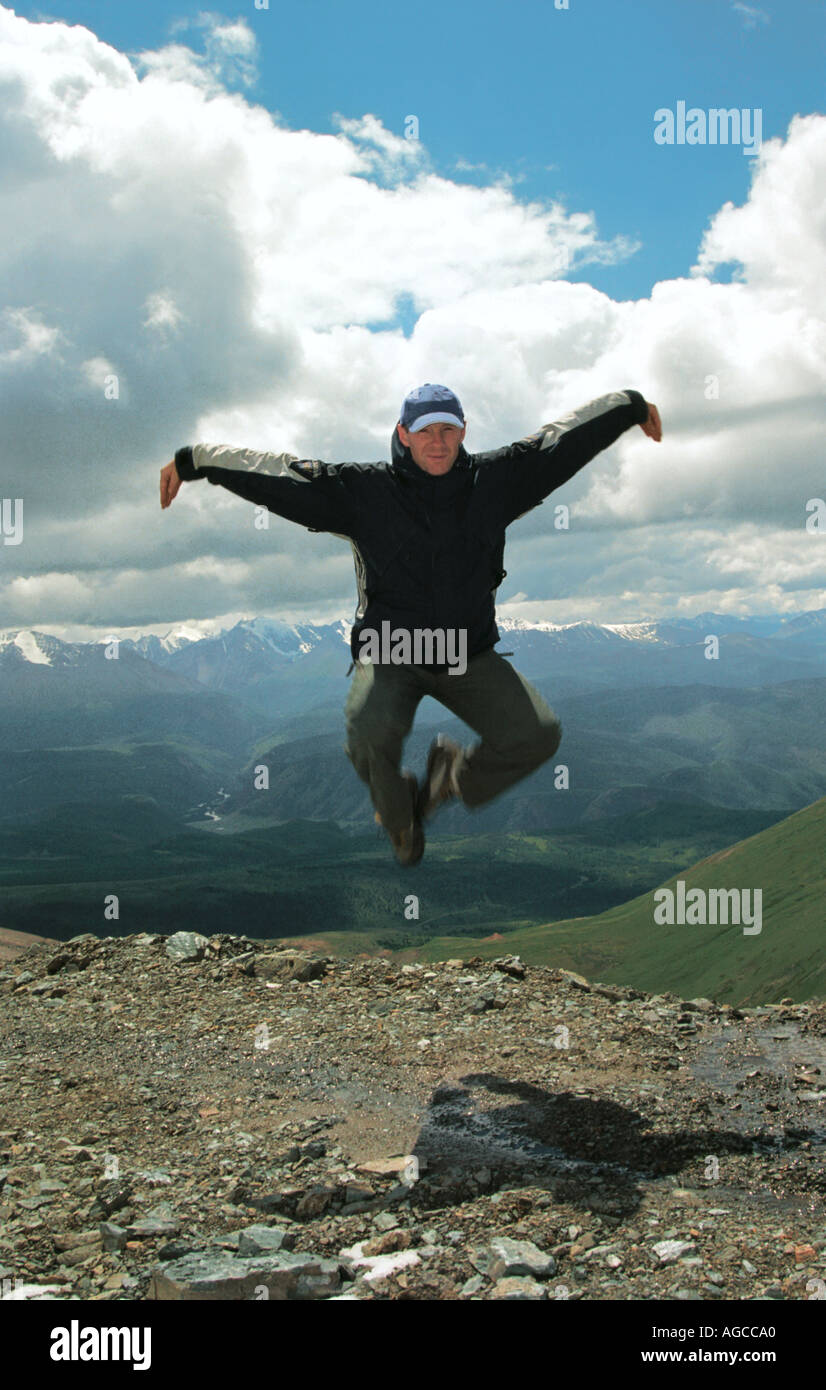 Jumping man Altai Russia Stock Photo - Alamy