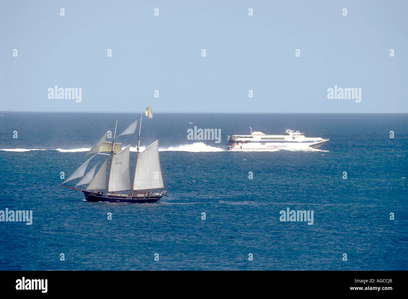 A gaff rigged topsail schooner and a SeaCat wavepiercer catamaran Stock ...