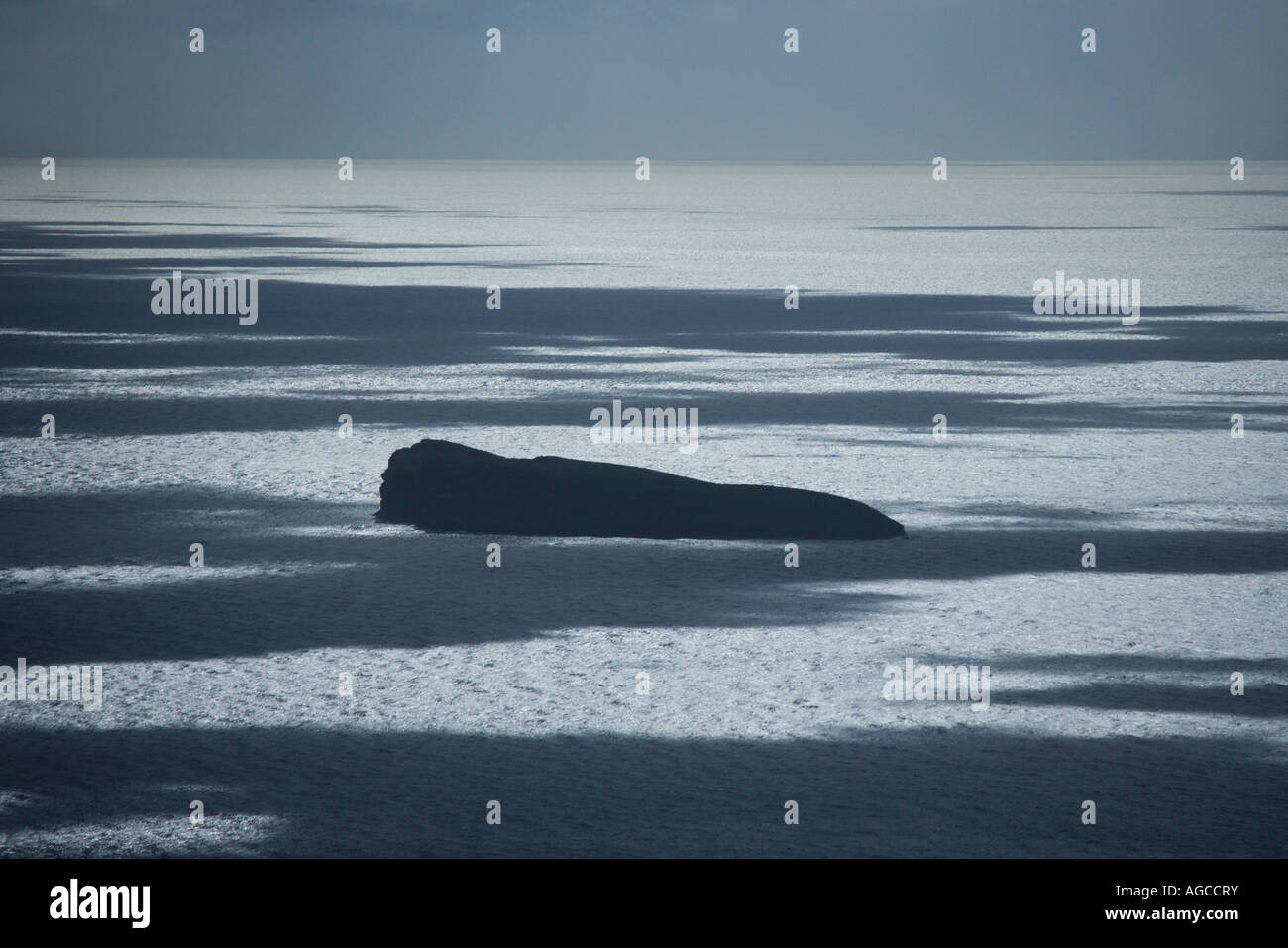 Large rock island in Pacific ocean Stock Photo - Alamy