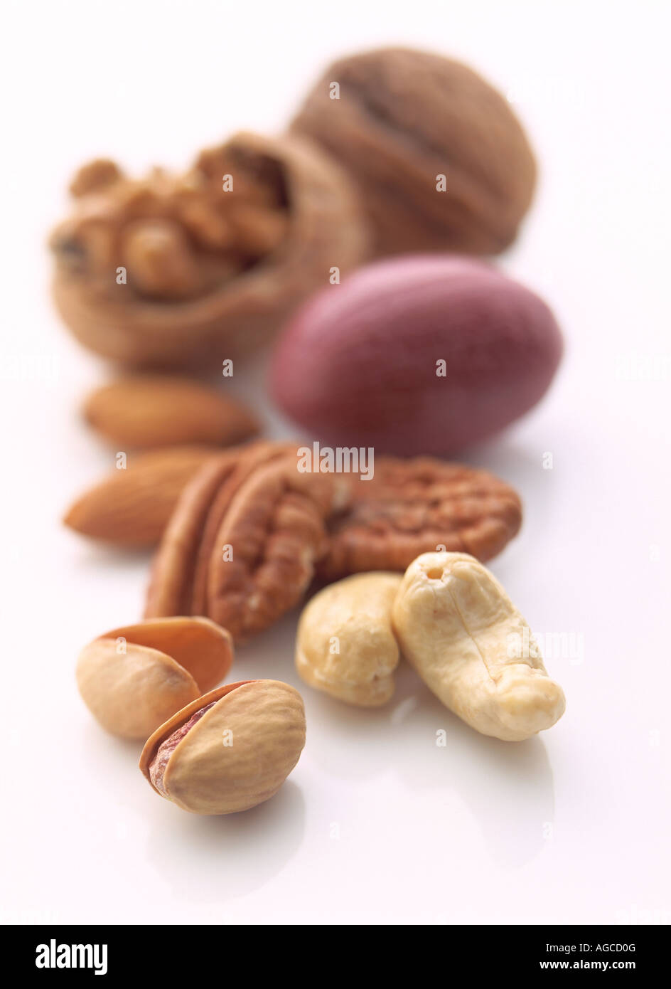 Assorted nuts on a white background Stock Photo - Alamy