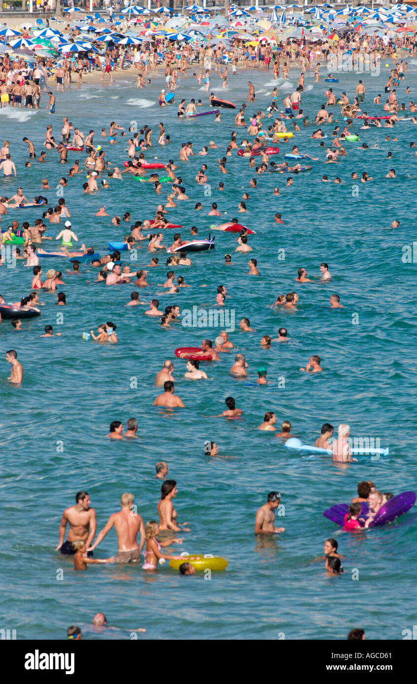 tourists enjoying a swim inthe waters of Benidorm Costa Blanca Spain ...