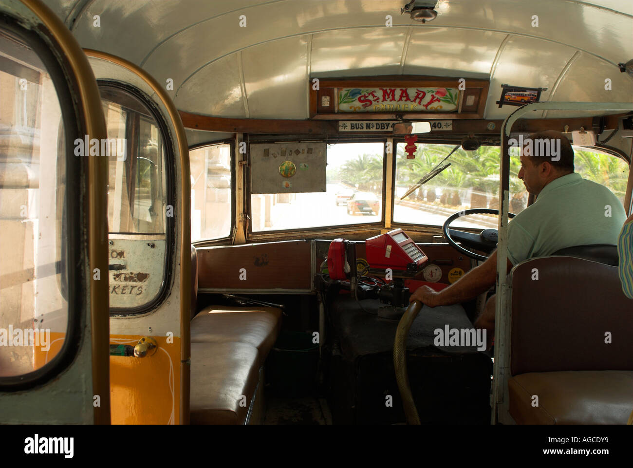Inside a Maltese bus with the driver Stock Photo - Alamy