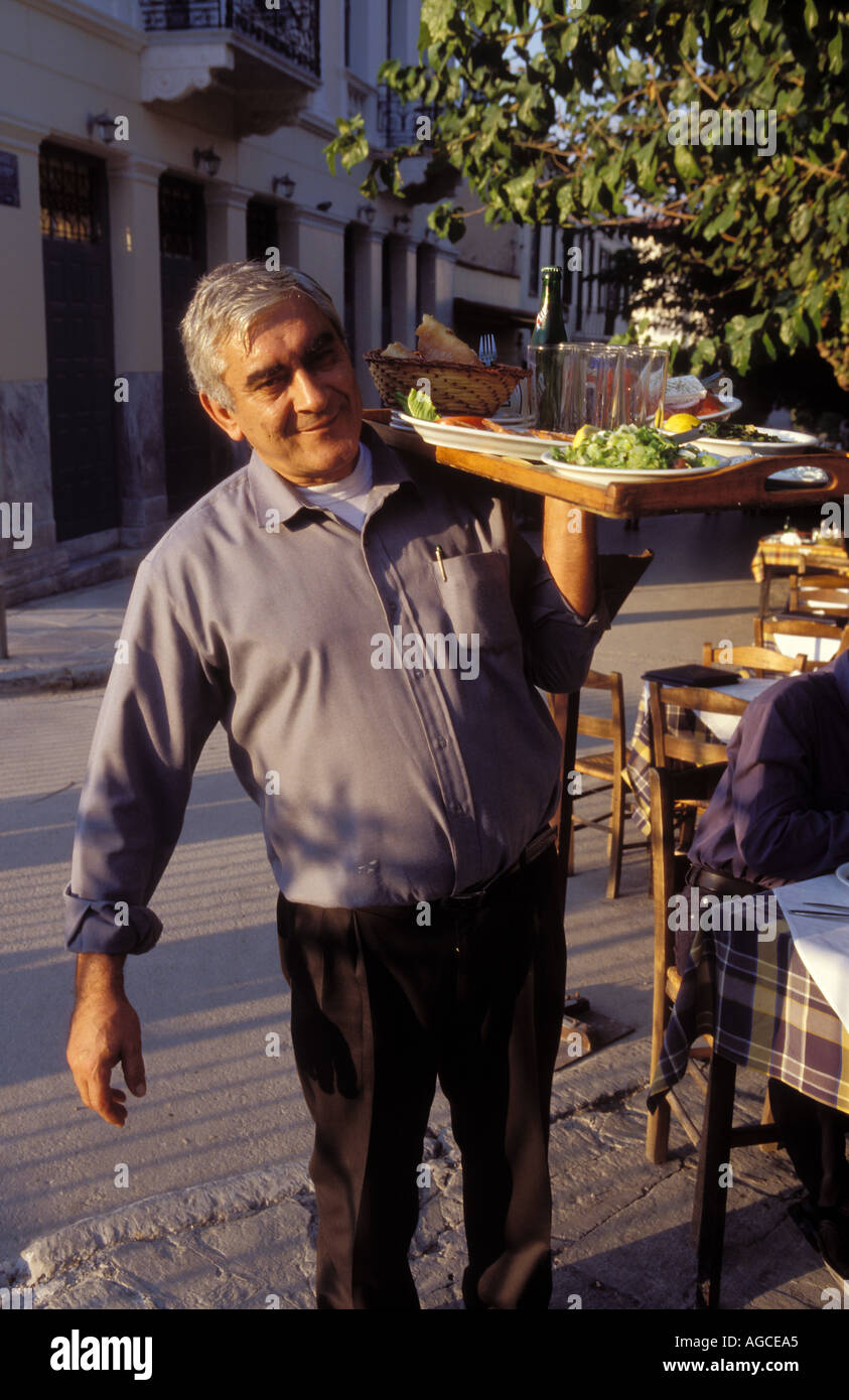 Greece Athens Waiter serving food at an outdoors taverna Stock Photo ...