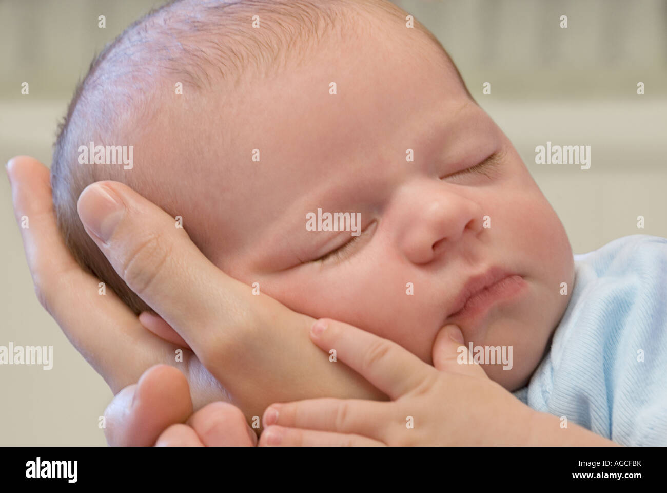 Baby boy asleep in mothers hi-res stock photography and images - Alamy