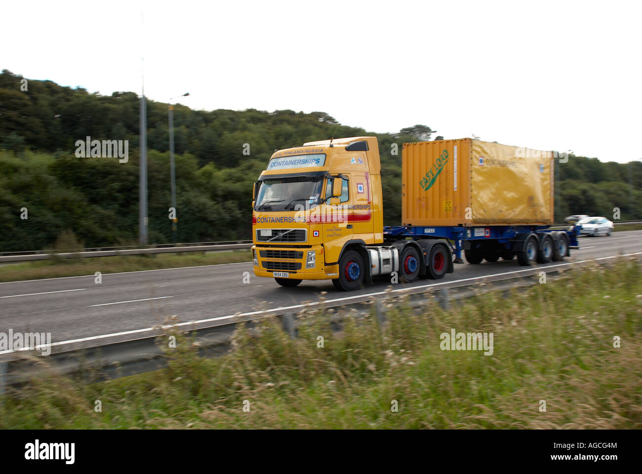 yellow container lorry Stock Photo - Alamy